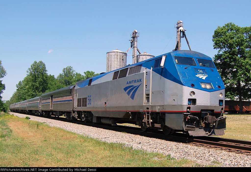 Amtk P-42DC #56 leads a southbound past the old mill